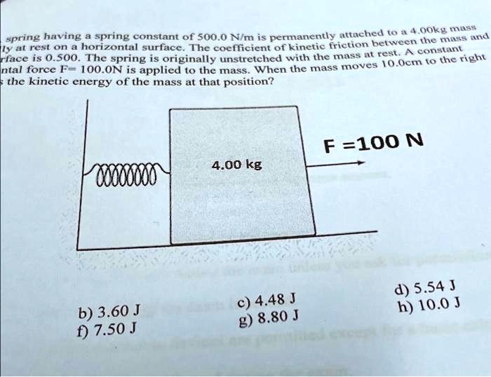 spring having a spring constant of 500.0 N/m is permanently attached to ...