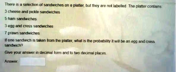 There is a selection of sandwiches on a platter but they are not ...