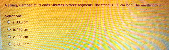 A string; clamped at its ends vibrates in three segments. The string is ...