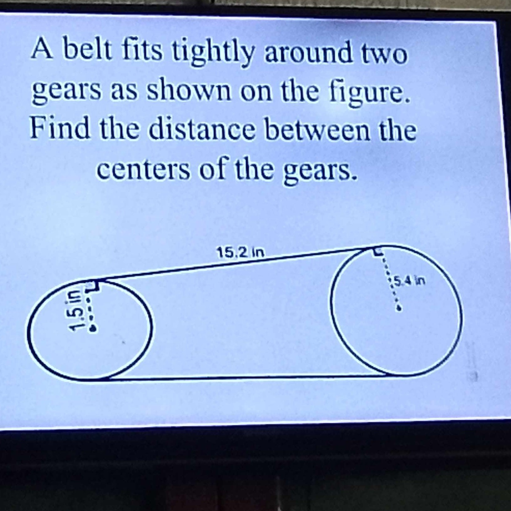 SOLVED: A belt fits tightly around two gears as shown on the figure. Find the distance between ...