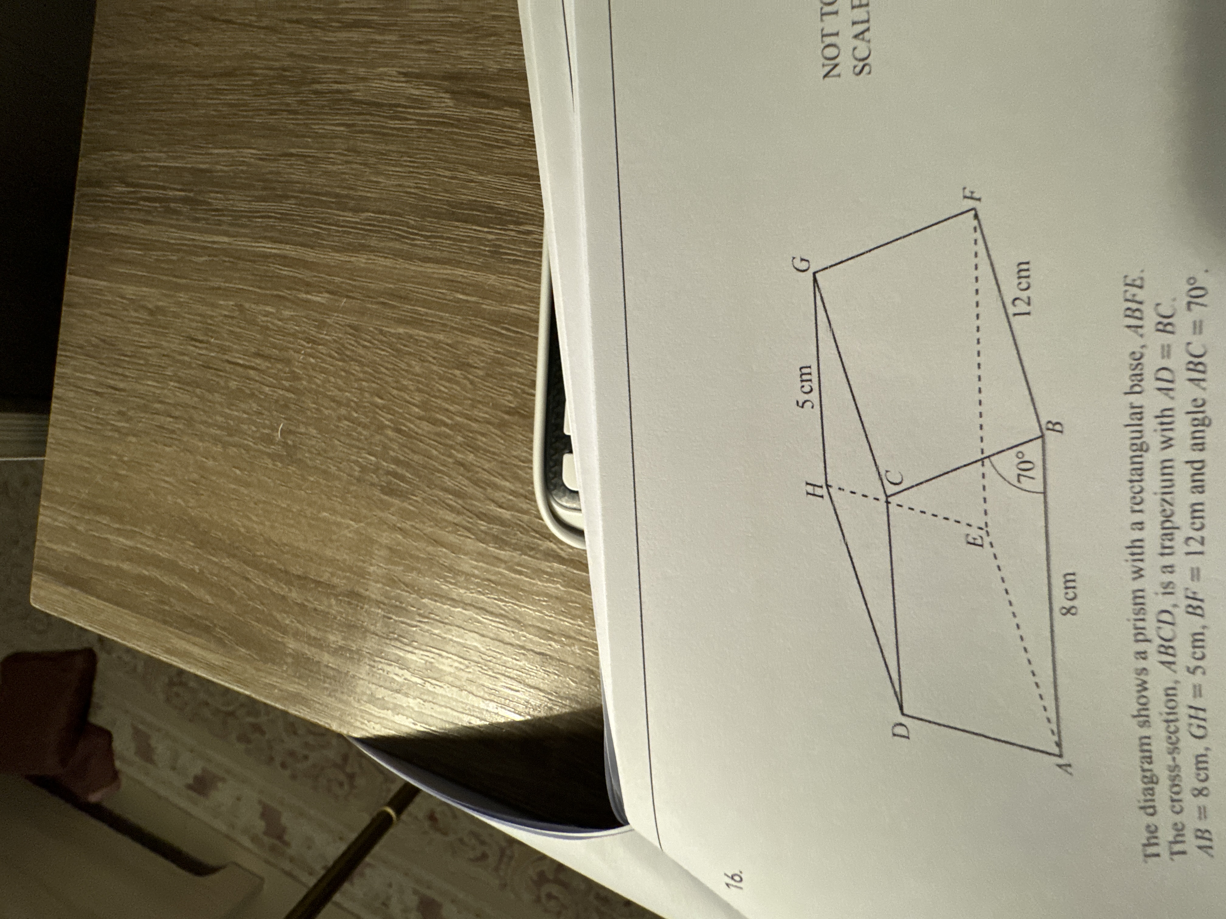 16. NOT T SCALF The diagram shows a prism with a rectangular base, A B ...