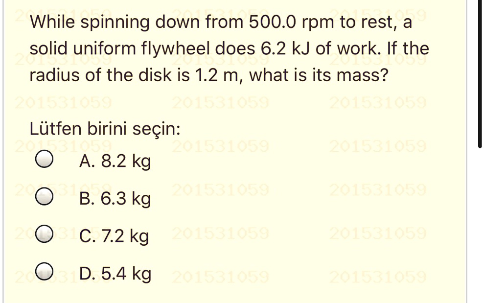 While spinning down from 500.0 rpm to rest, a solid uniform flywheel ...