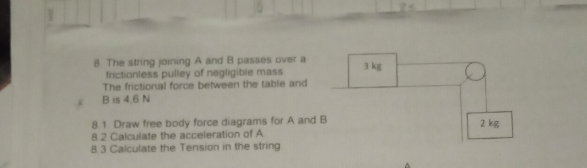 8. The string joining A and B passes over a frictionless pulley of negligible mass The ...
