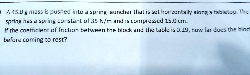 a 450 g mass is pushed into spring launcher that is set horizontally ...