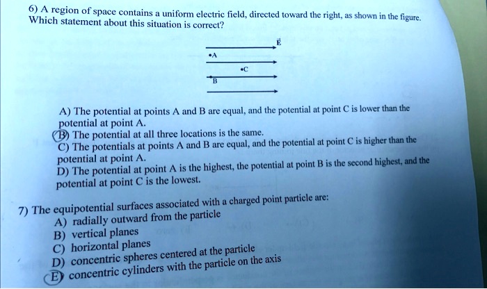 SOLVED: A region of space contains a uniform electric field, directed ...