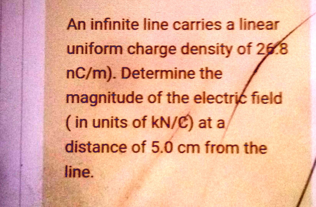 An infinite line carries a linear uniform charge density of...