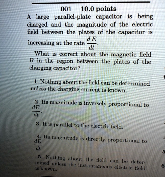 SOLVED: A large parallel-plate capacitor is being charged and the ...