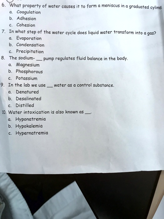 What property of water causes it to form meniscus in...