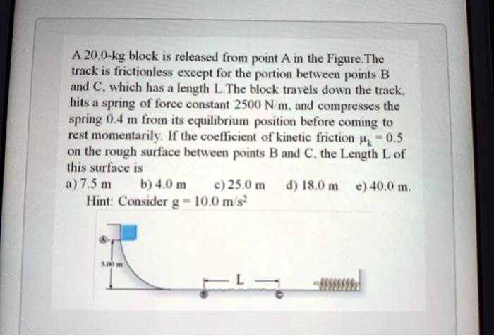 a200 kg block is released from point a in the figure the track is frictionless except for the ...