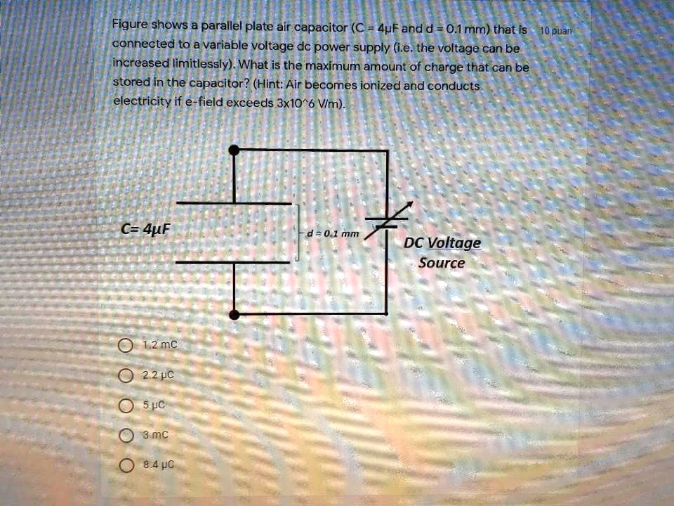 SOLVED: Figure shows a parallel plate air capacitor (C = ApF and d = 0.1 mm) that is puan ...