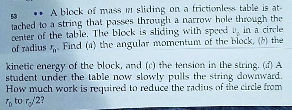 53 .. A block of mass m sliding on a frictionless table is attached to a string that passes ...