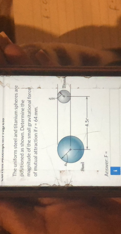 The uniform steel and titanium spheres aye pokitioned as...