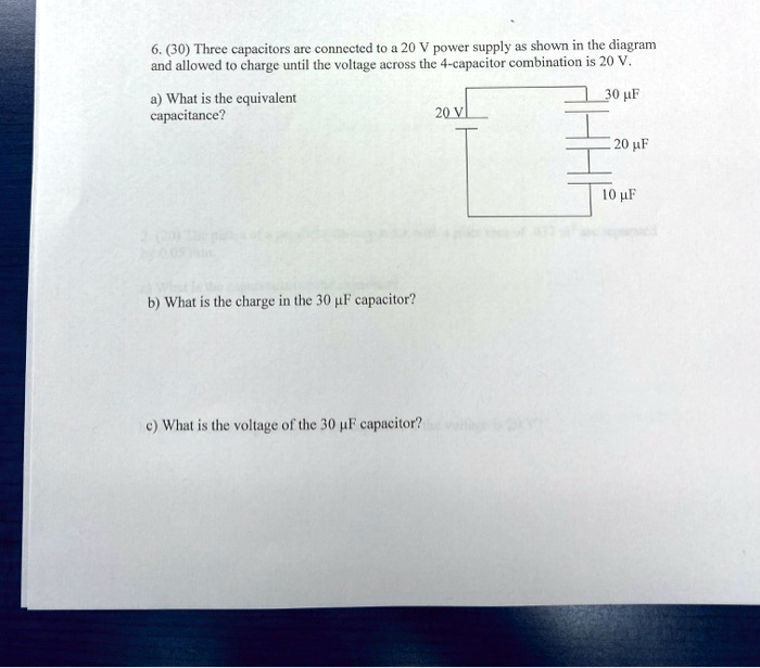 30 three capacitors are connected power supply shown in the diagram and ...