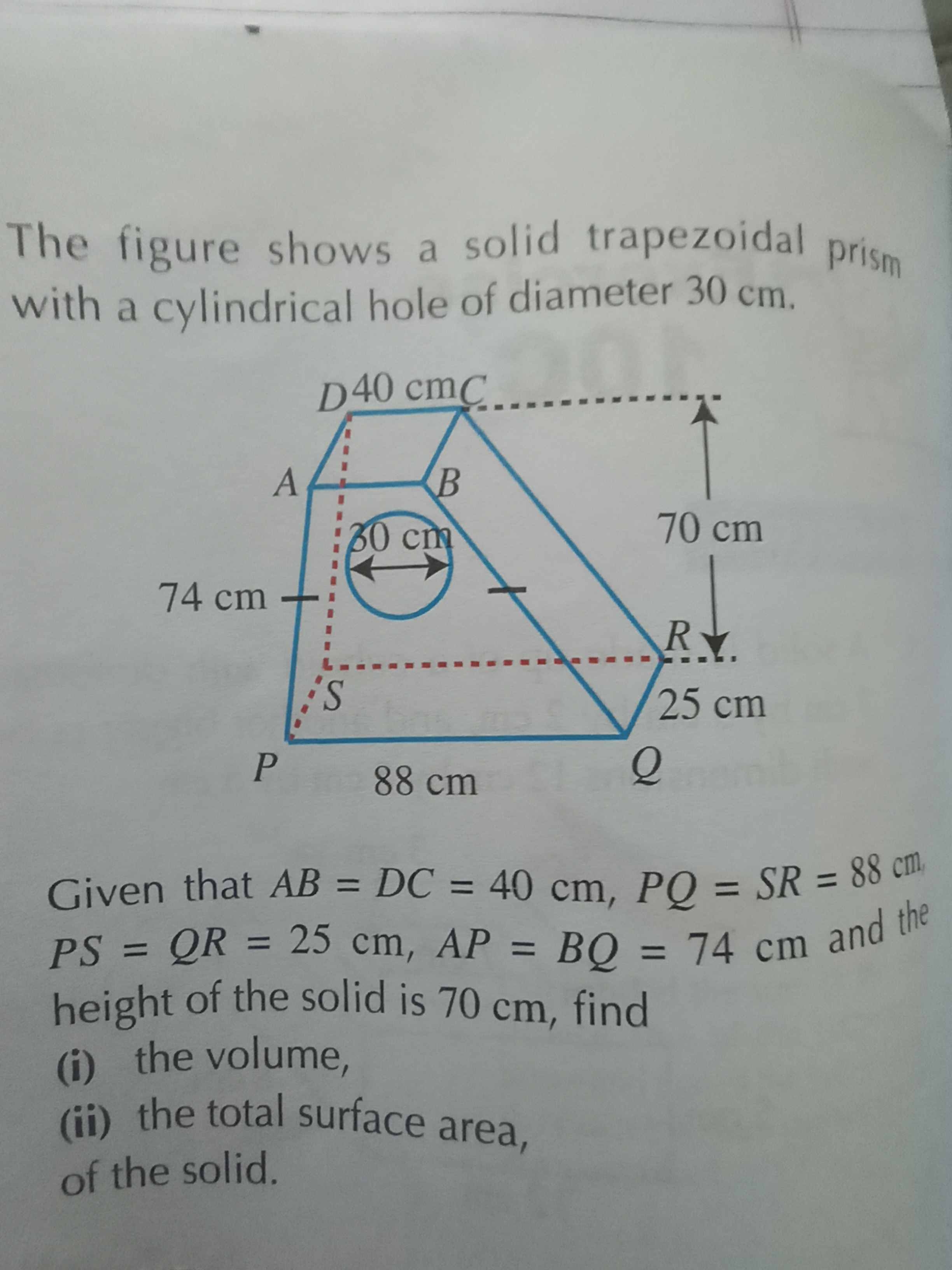 SOLVED: The figure shows a solid trapezoidal prism with a cylindrical ...