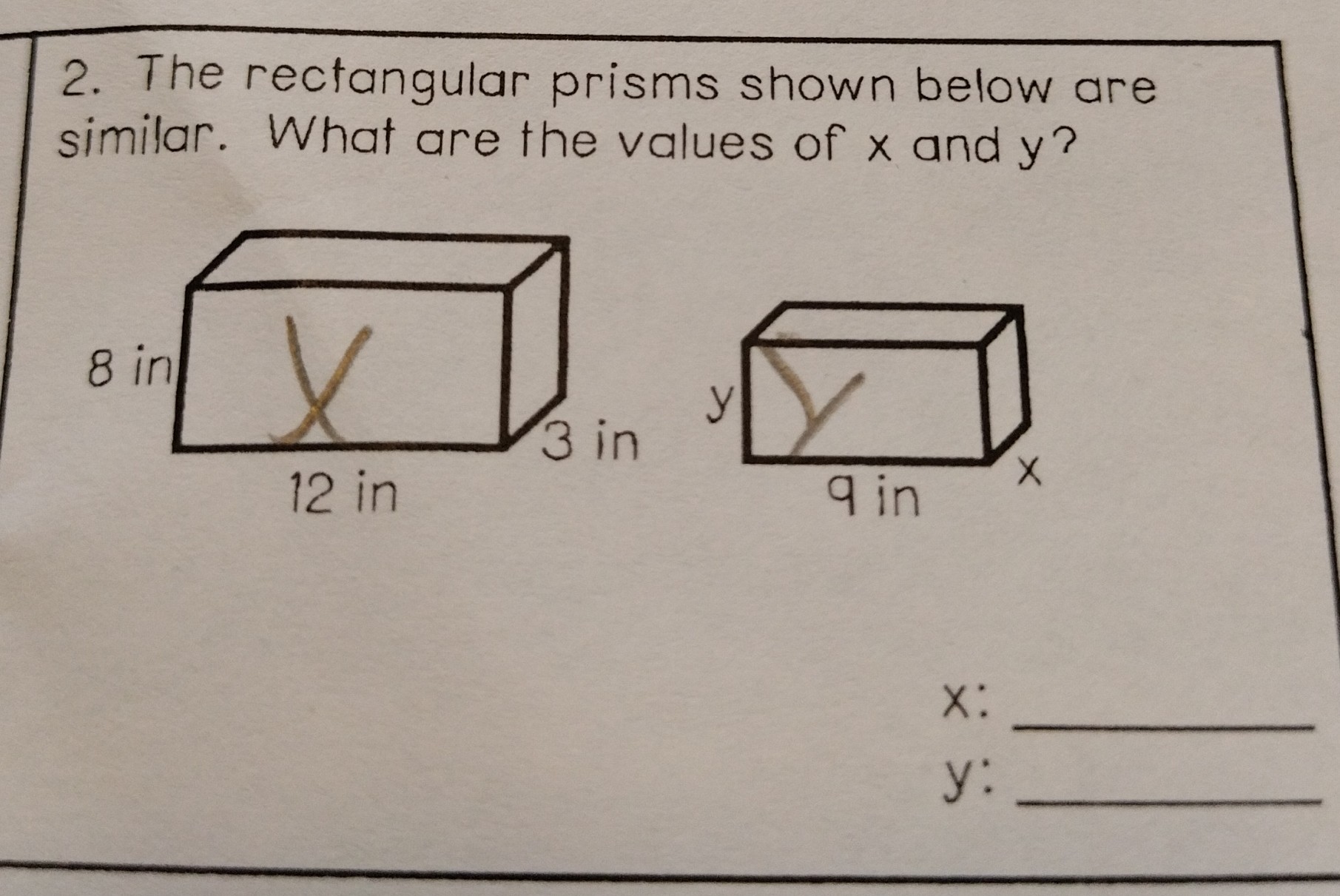 2. The rectangular prisms shown below are similar. What are the values of x and y ? x : y:
