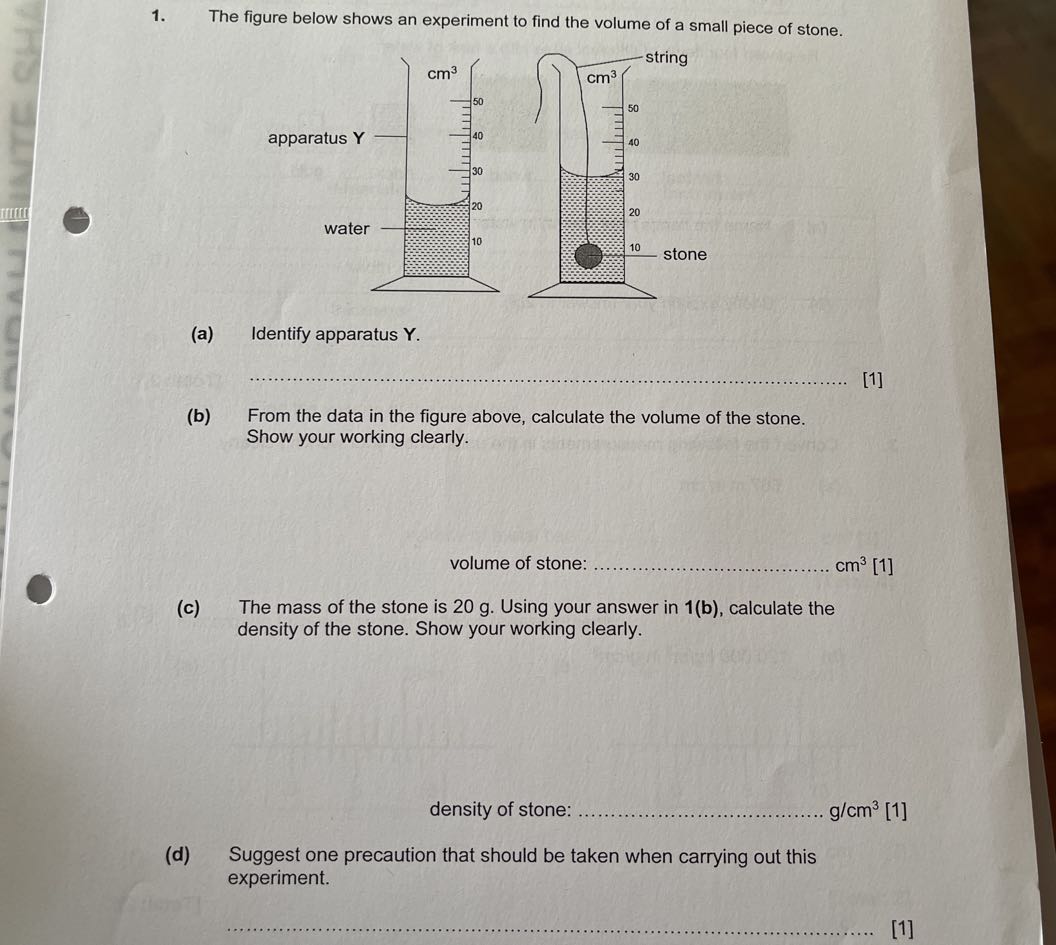 1. The figure below shows an experiment to find the volume of a small ...