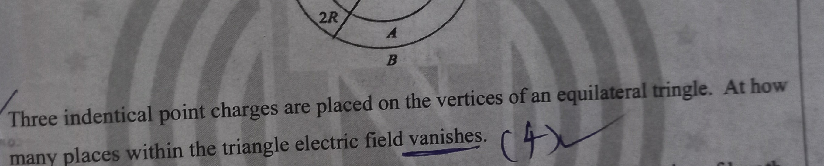 Three indentical point charges are placed on the vertices of an ...