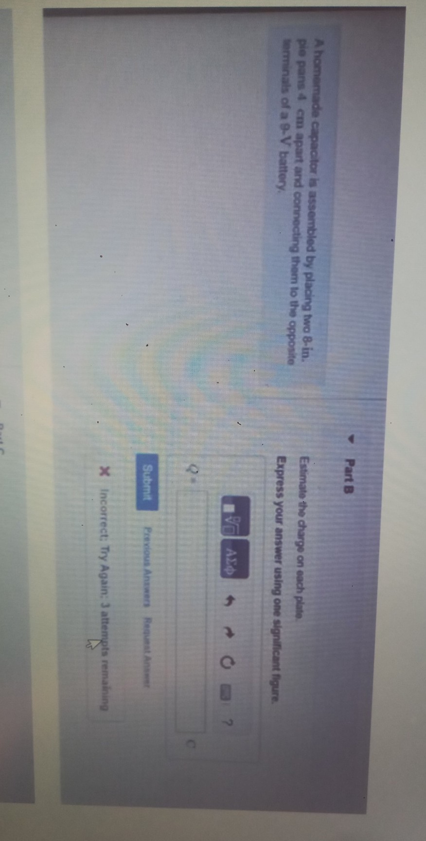 Part B A homemade capacitor is assembled by placing two 8 -in. pie pans ...