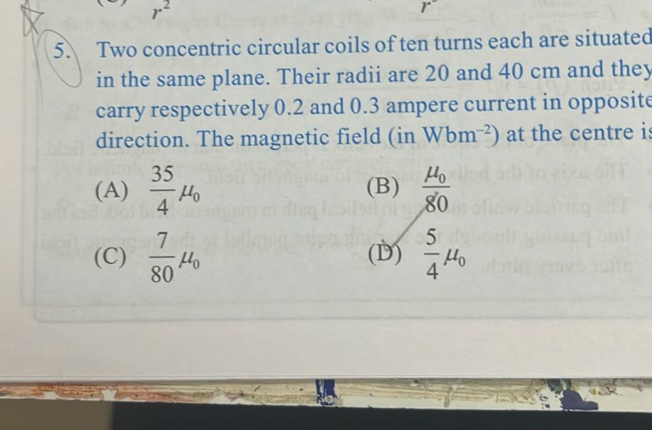 5. Two concentric circular coils of ten turns each are situated in the ...