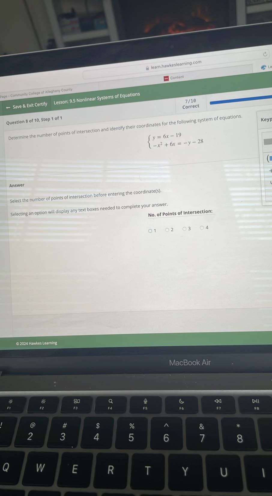 learn.hawkeslearning.com content Save & Exit Certify Lesson: 9.5 Nonlinear Systems of Equations ...