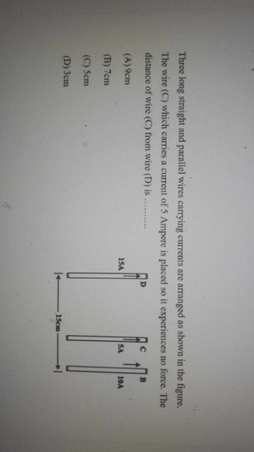 Three long straight and parallel wires carrying currents are arranged ...