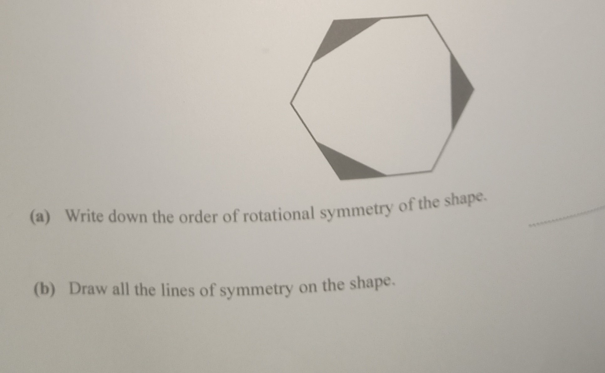 (a) Write down the order of rotational symmetry of the shape. (b) Draw ...
