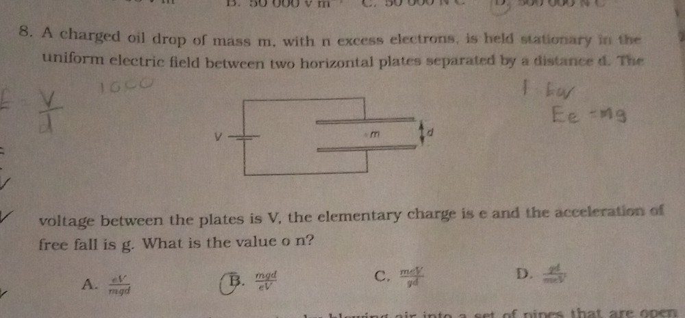8. A charged oil drop of mass m, with n excess electrons, is held ...