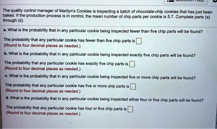 the quality control manager of marilyn cookies inspecting a batch of ...