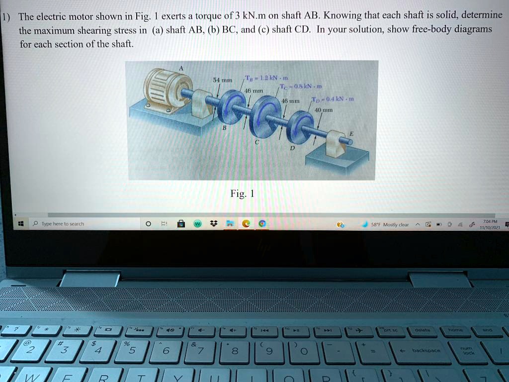 1) The electric motor shown in Fig. 1 exerts a torque of 3...