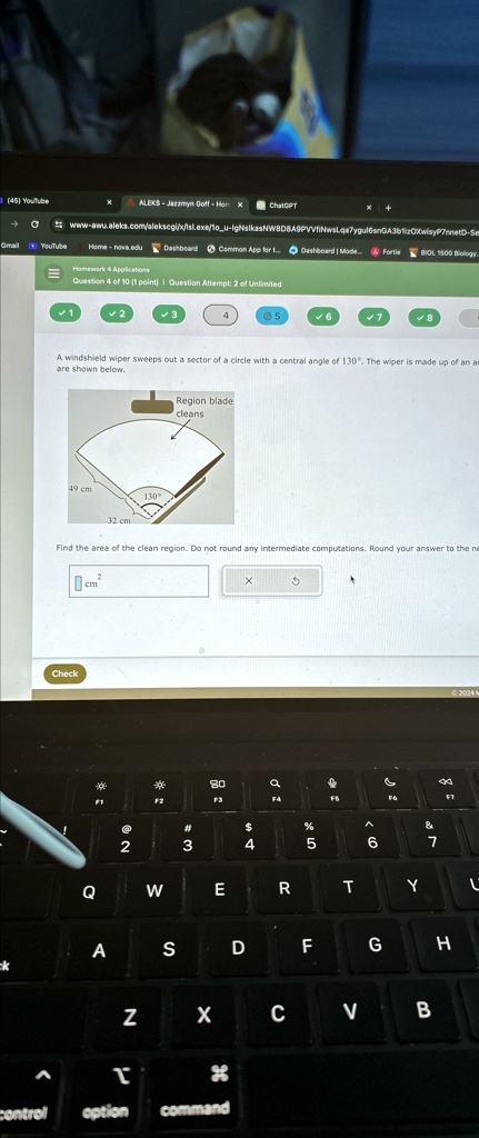 A windshield wiper sweeps out a sector of a circle with a central angle ...