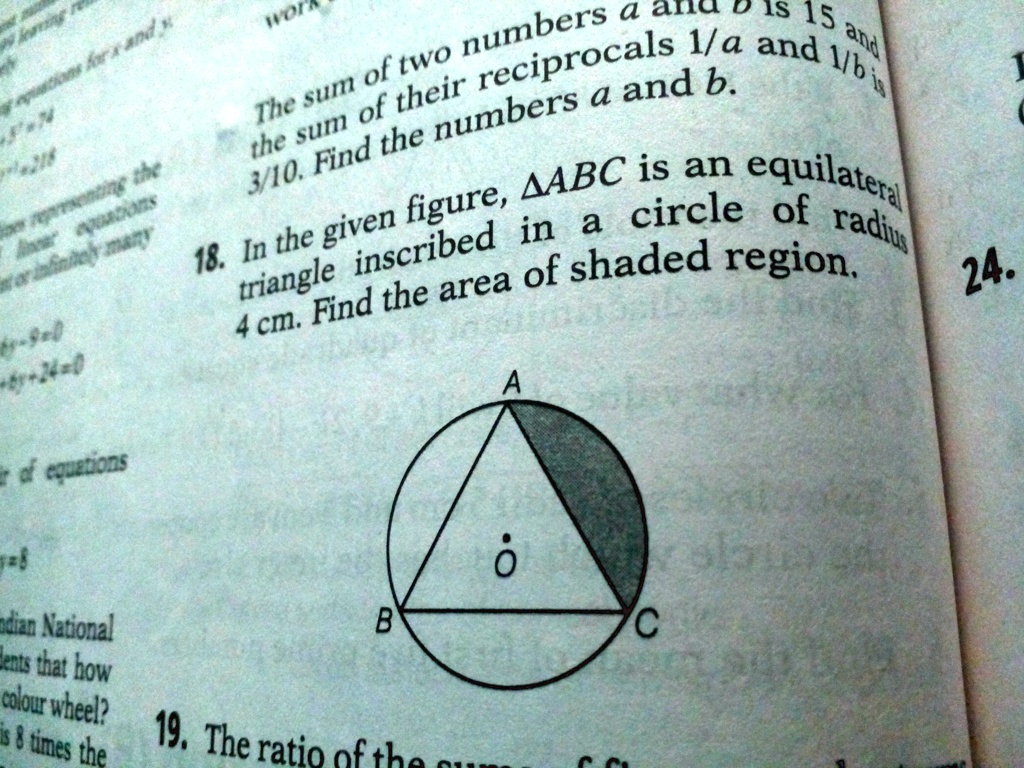 SOLVED: In the given figure, there is an equilateral triangle inscribed in a circle of radius 4 ...