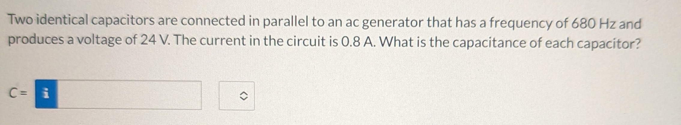 Two identical capacitors are connected in parallel to an ac generator ...