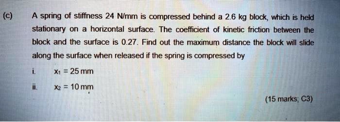 c a spring of stiffness 24 nmm is compressed behind a 26 kg blockwhich ...