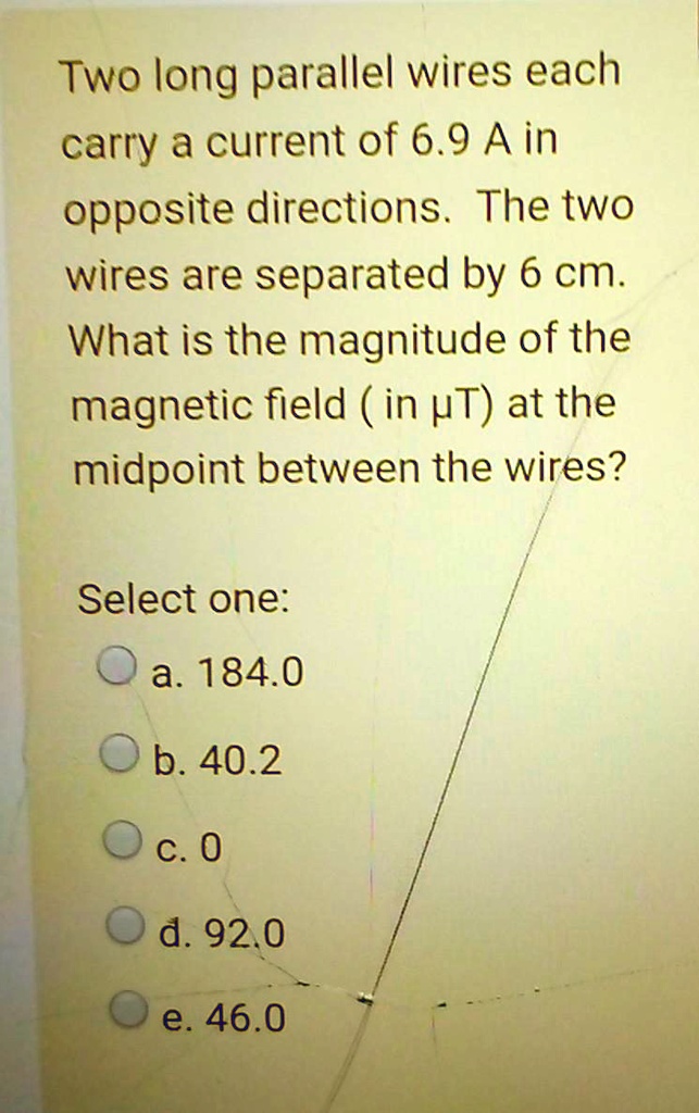 SOLVED: Two long parallel wires each carry a current of 6.9 A in ...